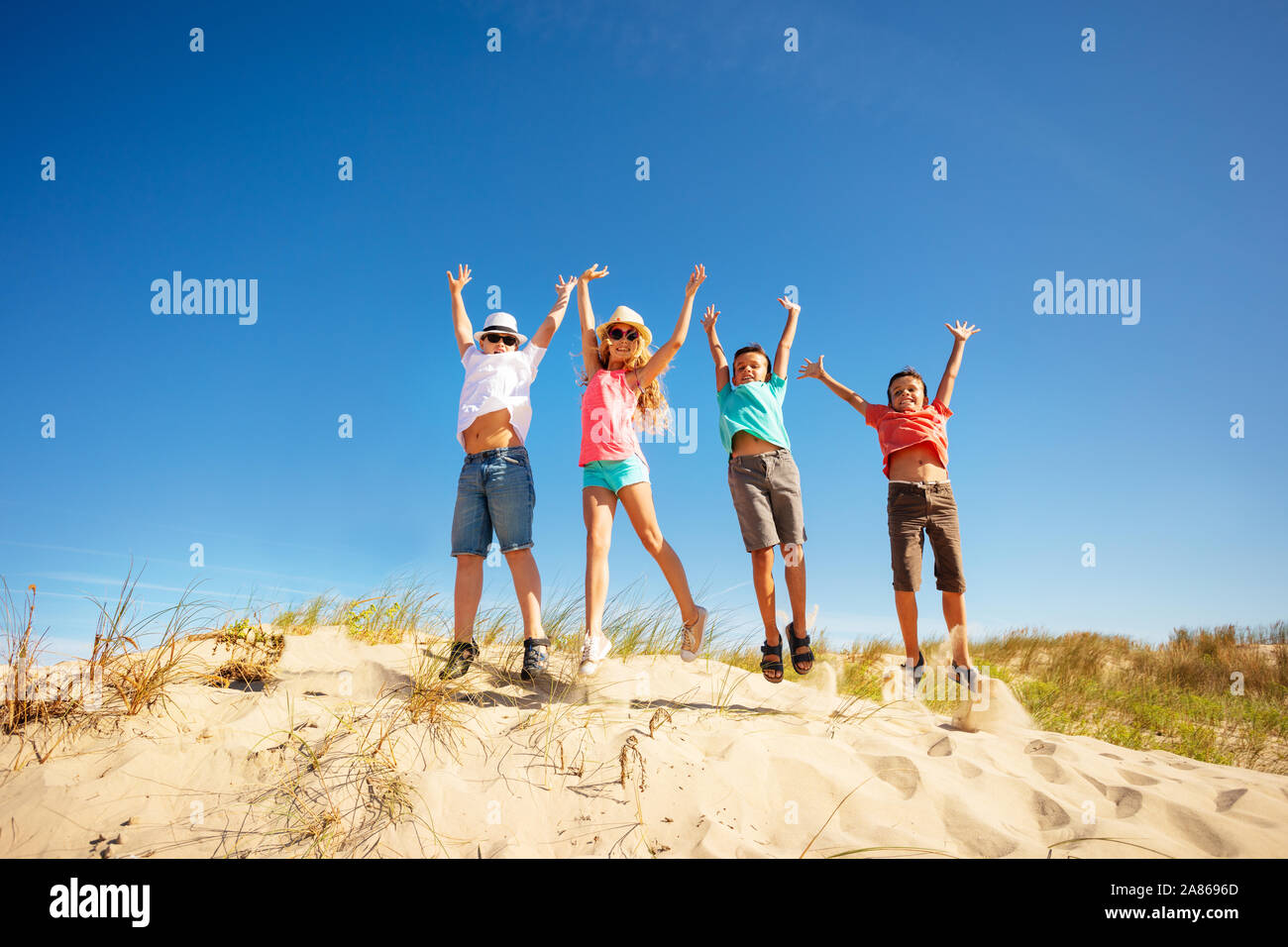 Children playing high jump hi-res stock photography and images - Alamy