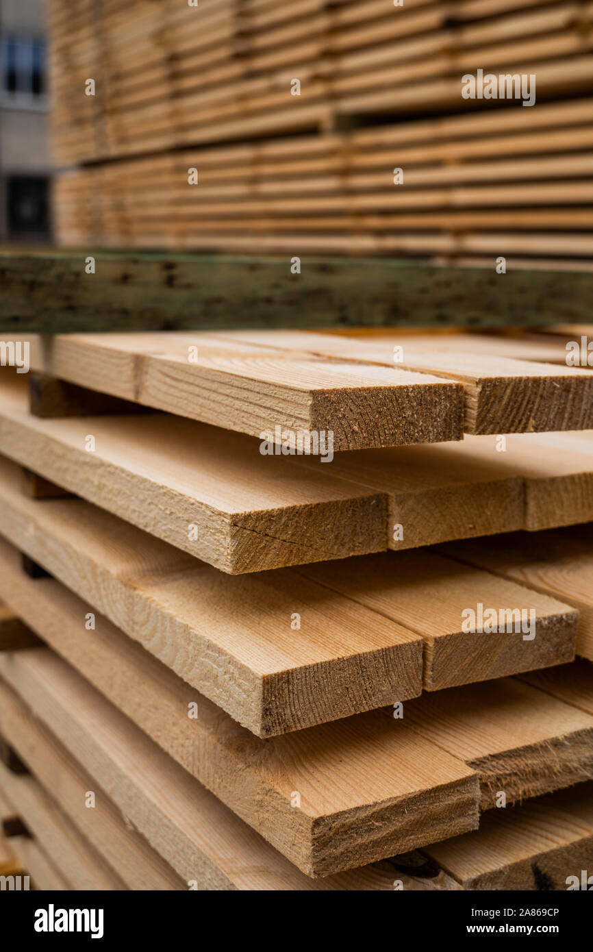 Piles of wooden boards in the sawmill, planking. Warehouse for sawing ...