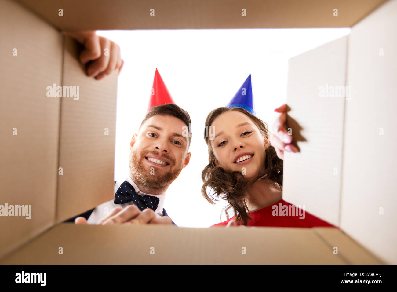 Woman opening birthday gift in hi-res stock photography and images - Alamy
