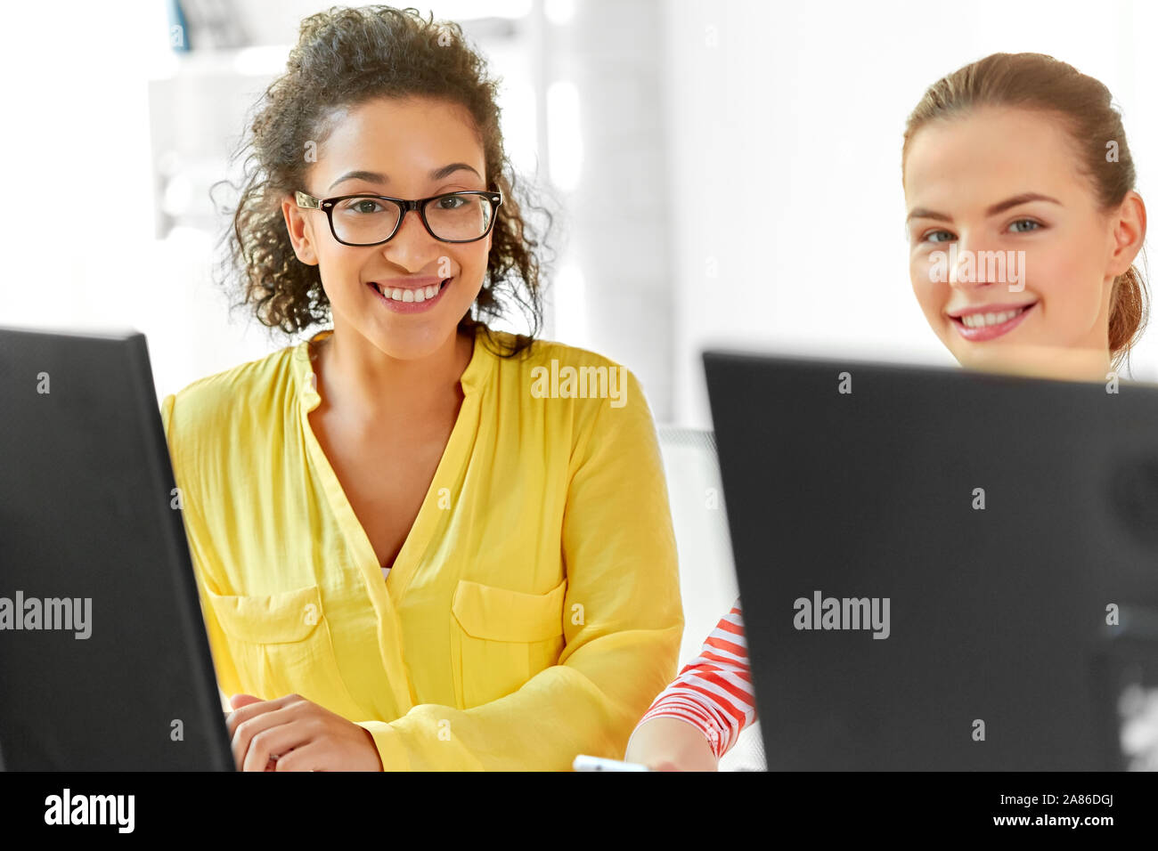 happy high school students in computer class Stock Photo - Alamy