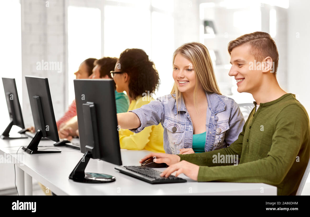 happy high school students in computer class Stock Photo - Alamy