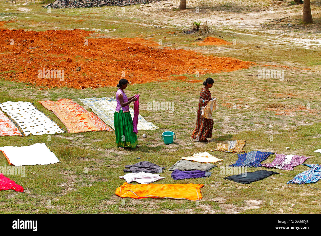 Indian woman drying clothes hi-res stock photography and images - Alamy