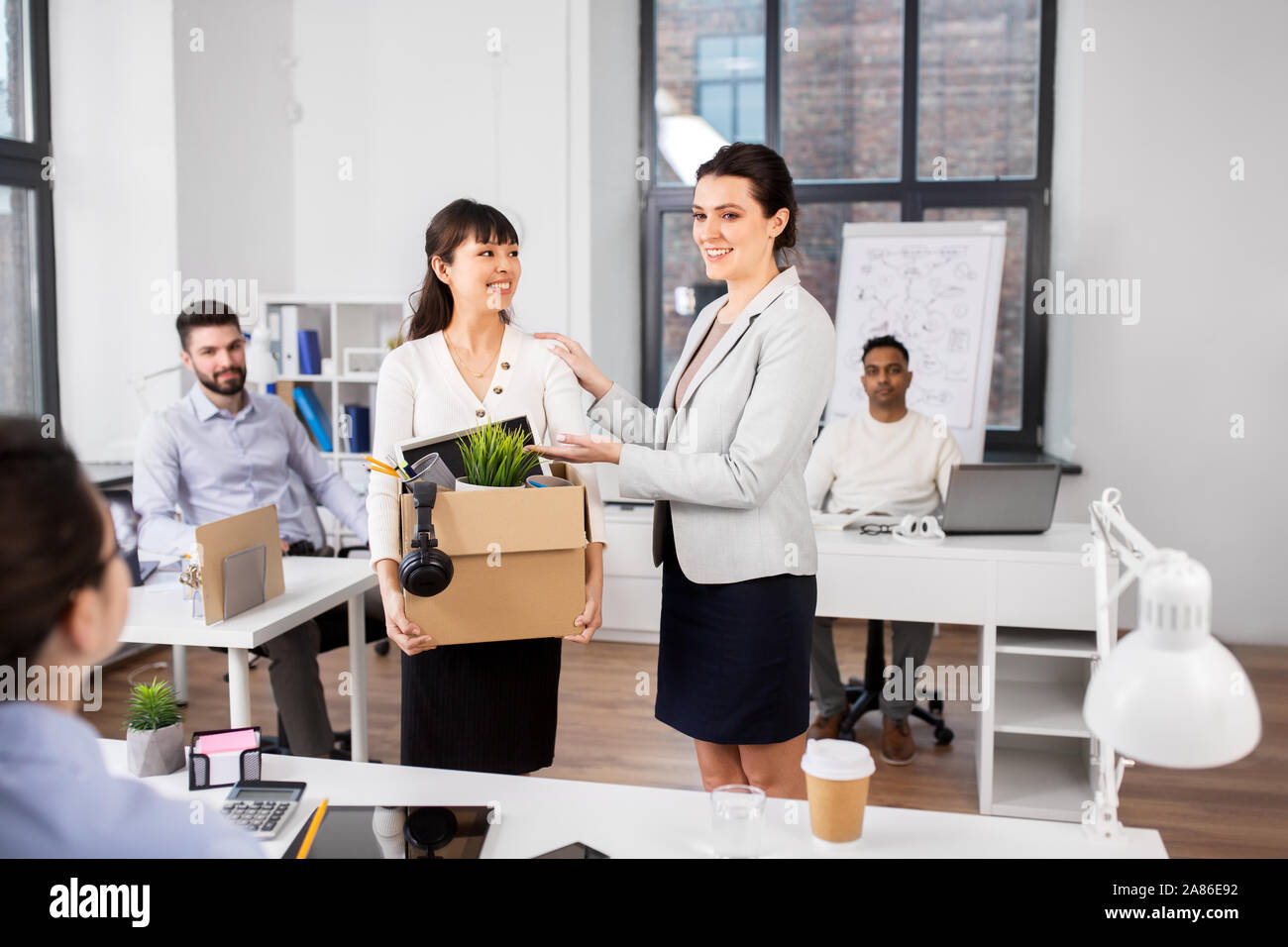 new female employee meeting colleagues at office Stock Photo - Alamy