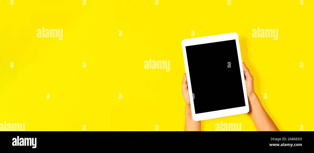 Child hands holding tablet device hi-res stock photography and images ...