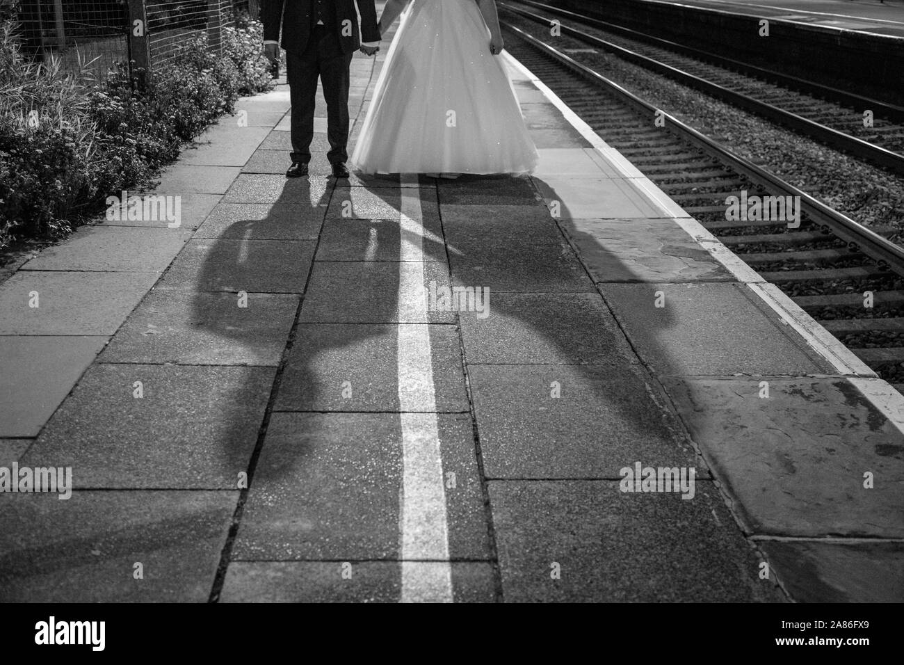 Couple walking on a train track hi-res stock photography and images - Alamy