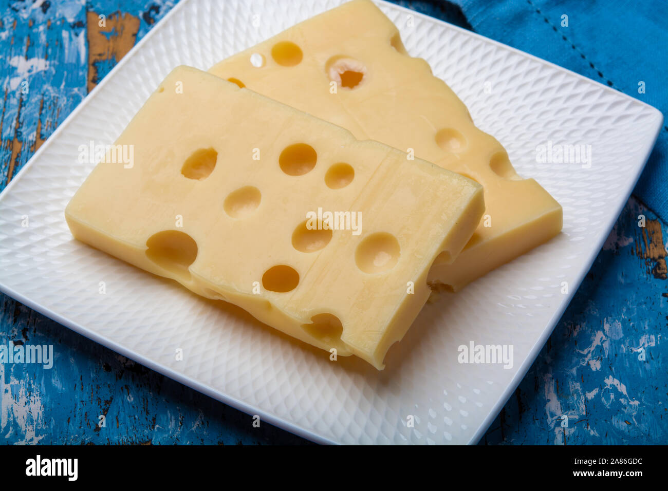 Two blocks of French emmental semi-hard cheese close up Stock Photo - Alamy