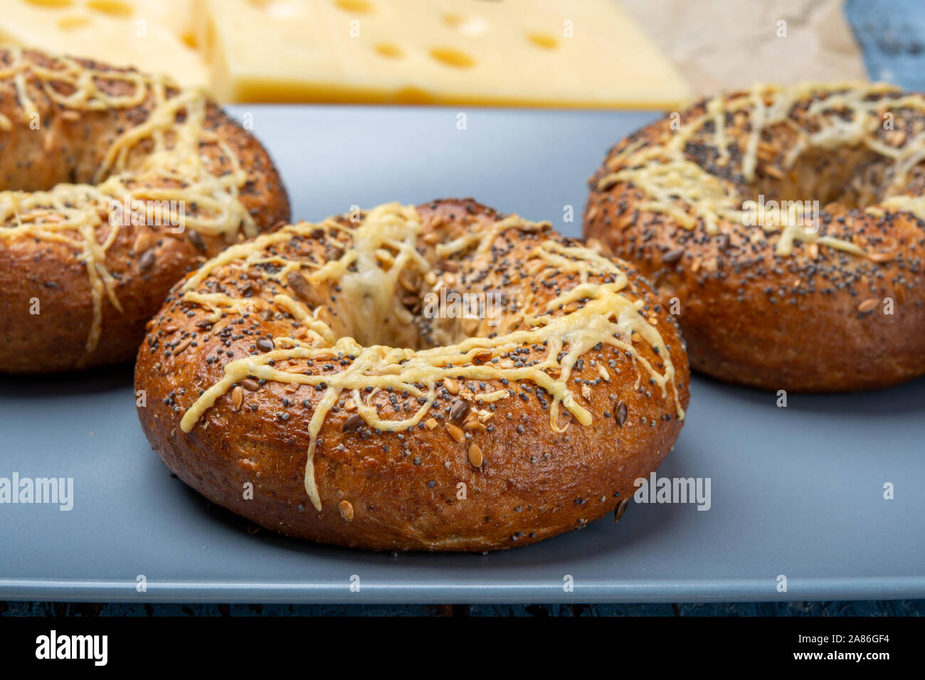 Tasty baked bagels with melted french emmental cheese close up Stock ...