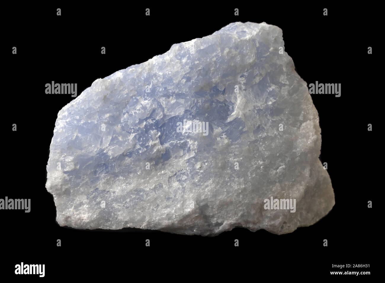 Rock of blue calcite mineral from Brazil isolated on a pure black ...