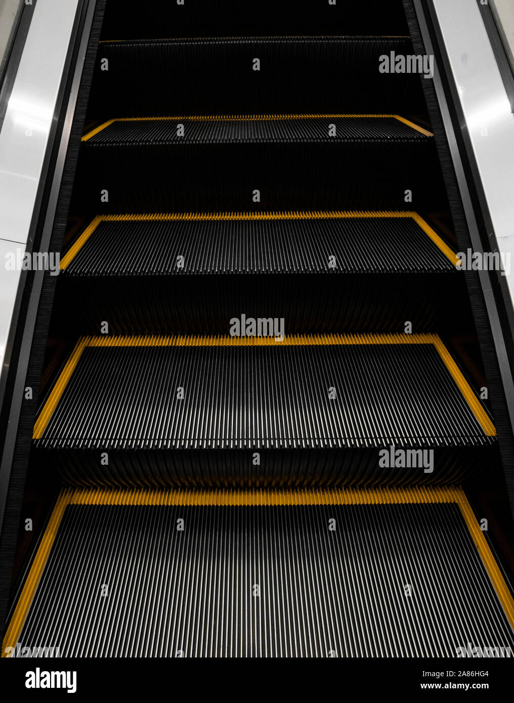 Modern escalator electronic system moving. Escalator is moving up.The ...