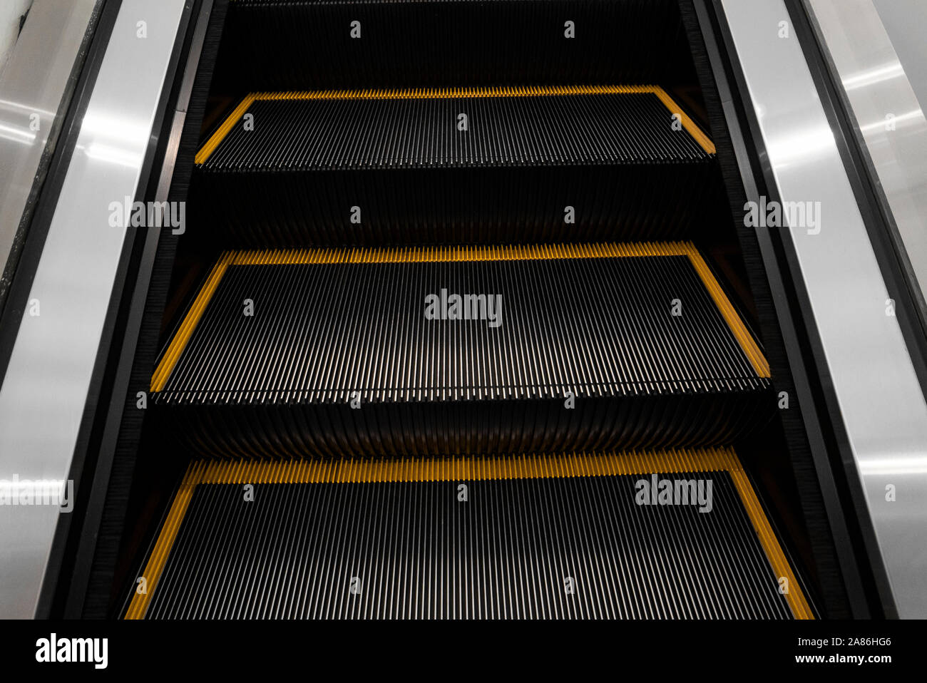 Modern escalator electronic system moving. Escalator is moving up.The ...