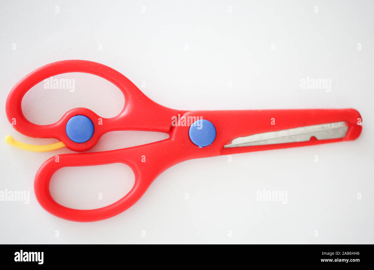 Red handle scissors placed on a white background - Image Stock Photo ...