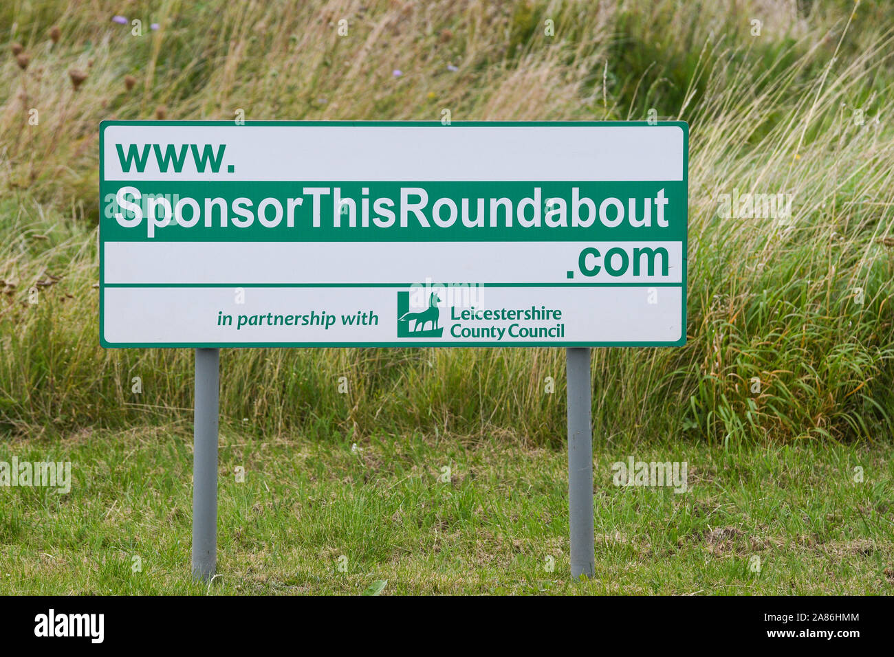 sponsor this roundabout sign Stock Photo - Alamy