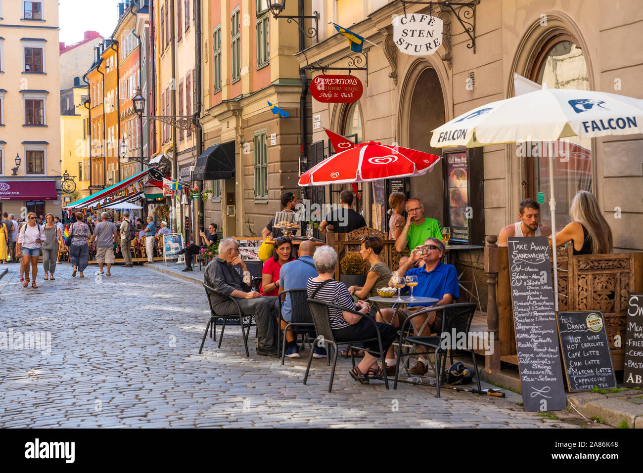 Shops,stores and outdoor restaurants in old town Gamla Stan in ...