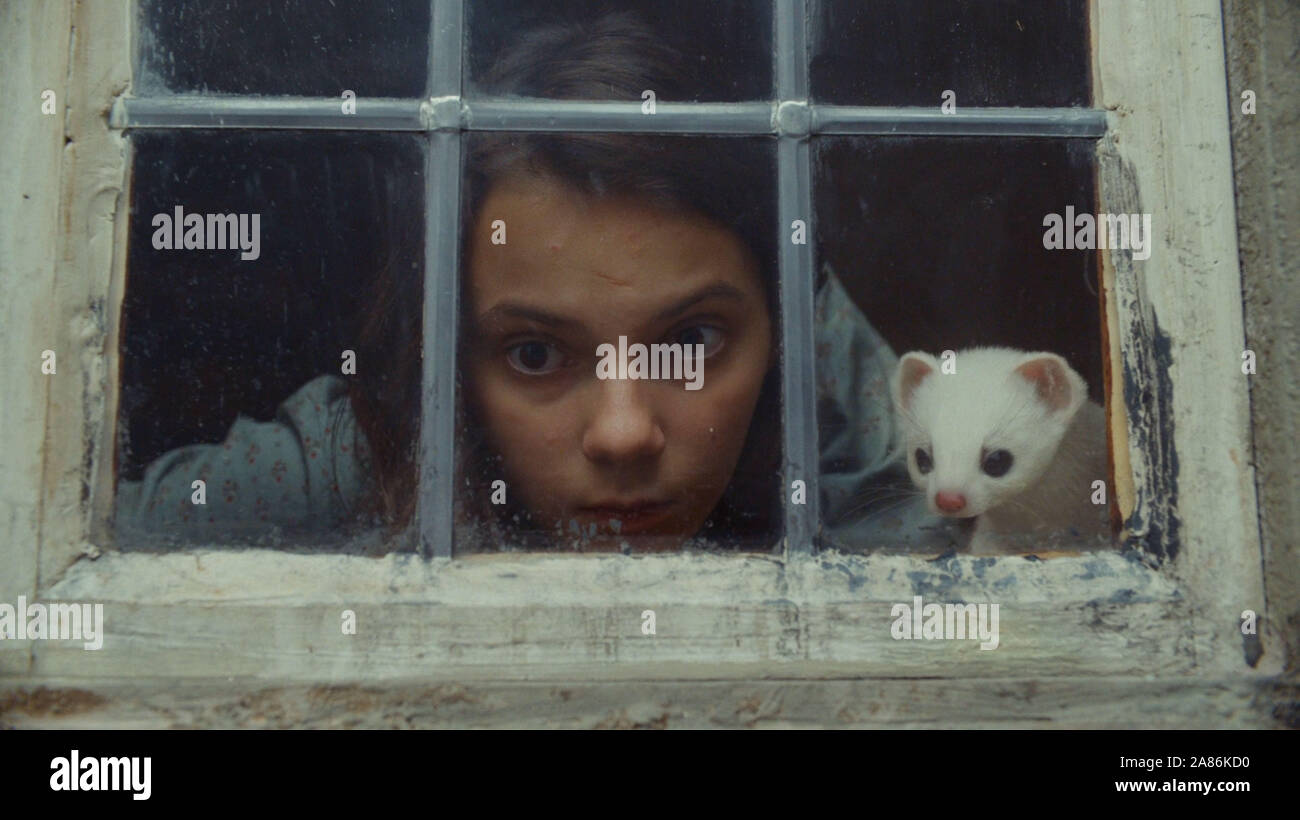 London.UK. Dafne Keen and shape shifting daemon Pantalaimon (voiced by ...