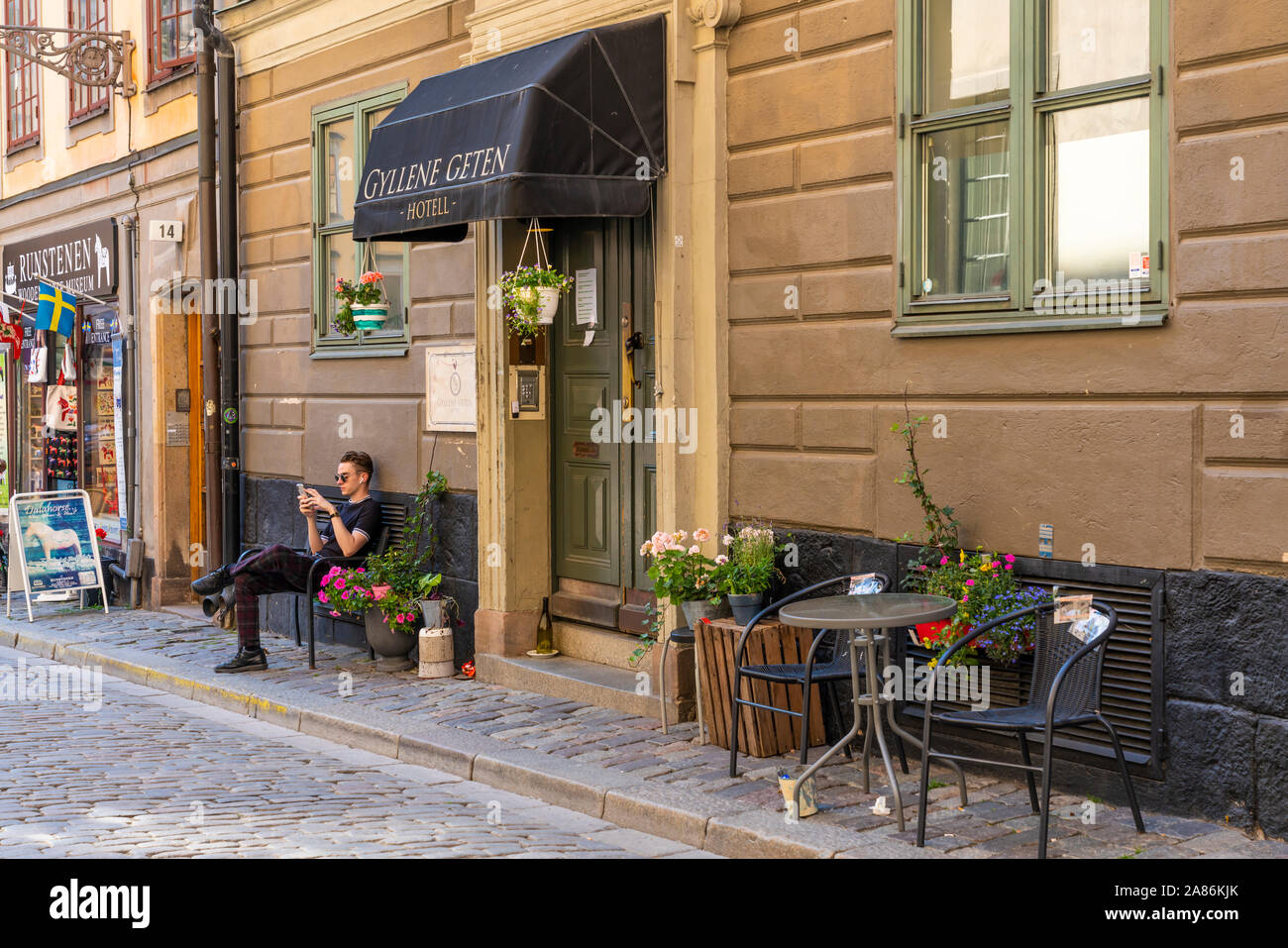 Shops,stores and outdoor restaurants in old town Gamla Stan in ...