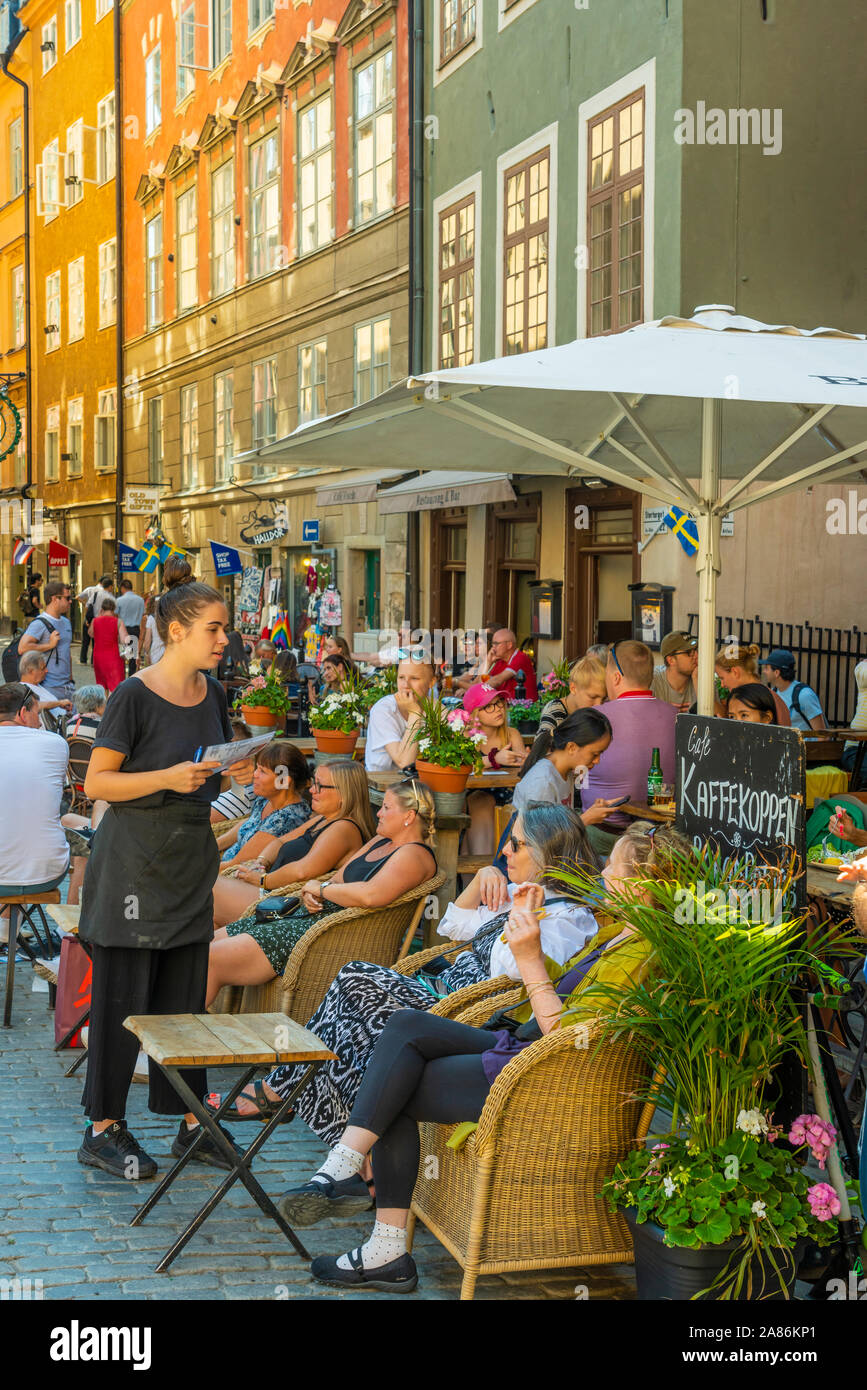 Shops,stores and outdoor restaurants in old town Gamla Stan in ...