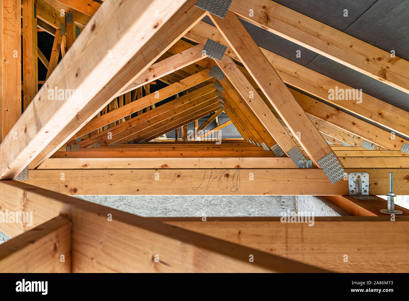 Roof trusses covered with a membrane on a detached house under ...