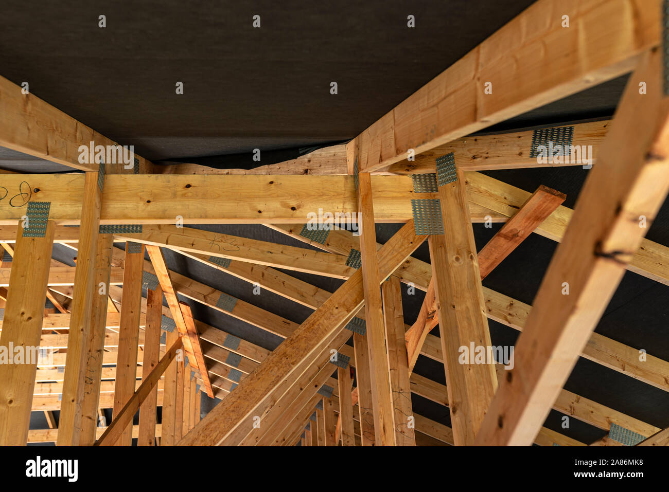 Roof trusses covered with a membrane on a detached house under ...