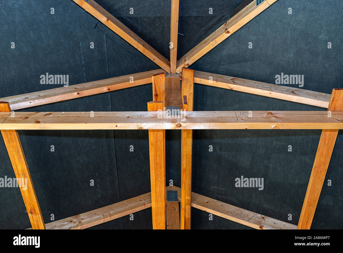 Roof trusses covered with a membrane on a detached house under ...