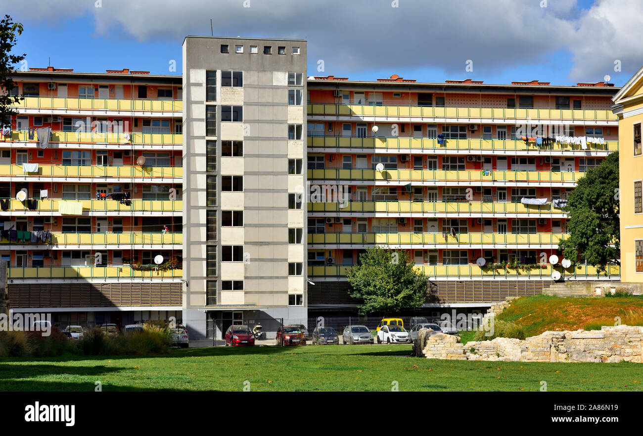 Modern multi-story apartment block which has some offices and shops ...