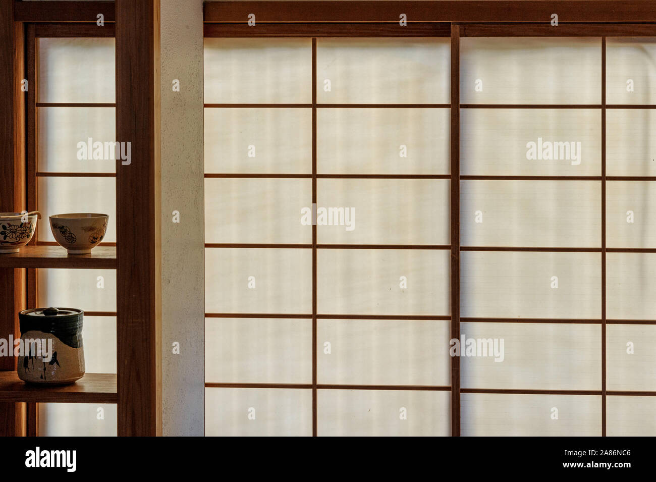 Interior of a Japanese styled room with pottery and shelves Stock Photo ...