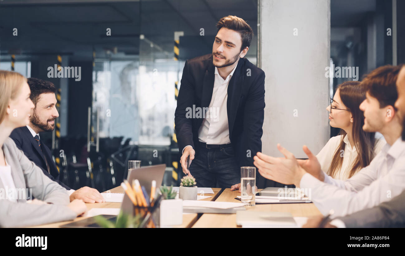 CEO boss talking to colleagues in the boardroom Stock Photo - Alamy