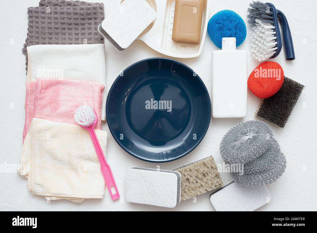 Dish washing accessories on the white flat lay background. Washing up ...