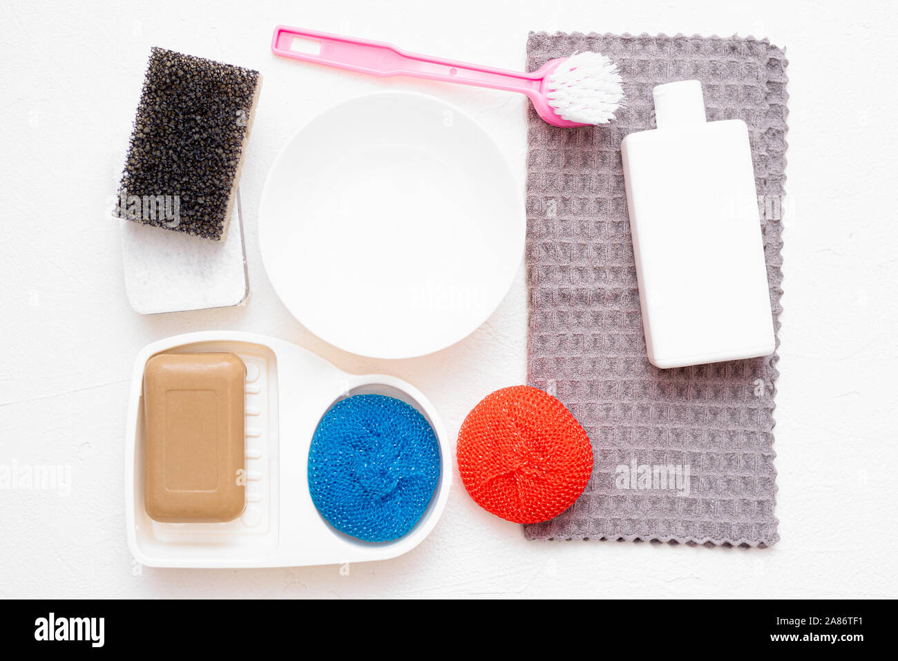 Dish washing accessories on the white flat lay background. Washing up ...