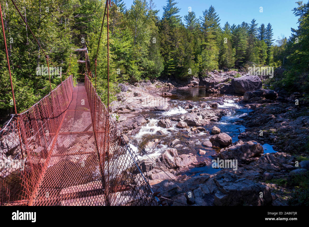 A suspension bridge crossing Upstate New York's Northville Placid Trail ...