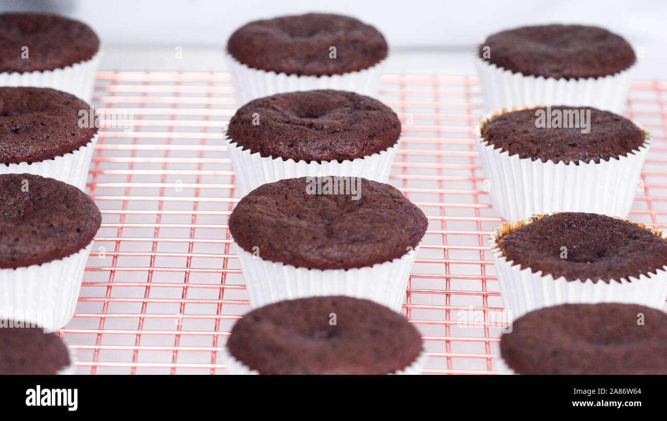 Step by step. Cooling freshly baked chocolate cupcakes on a cooling ...