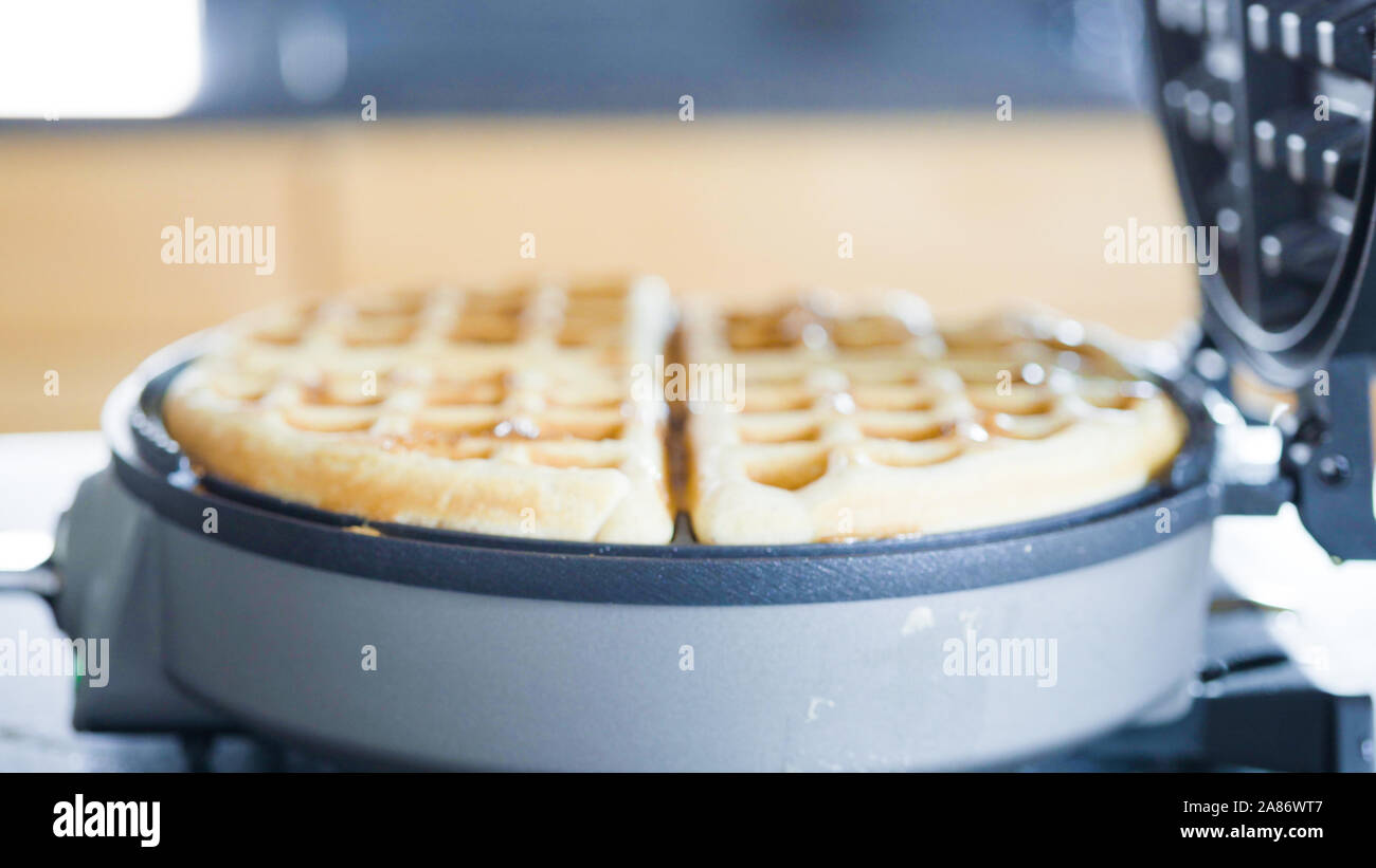 Making homemade waffles in an electric waffle maker Stock Photo - Alamy