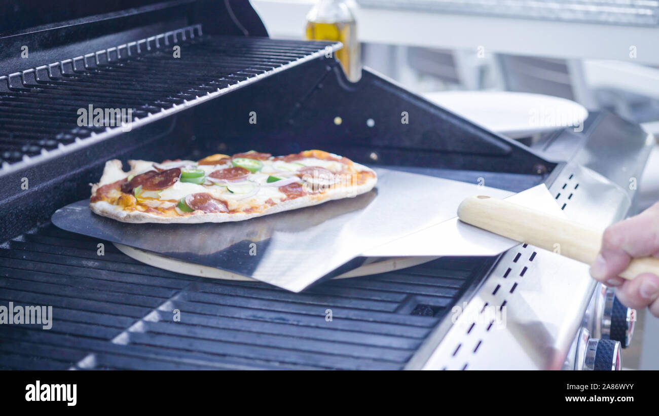 Cooking pizza on outdoor gas hi-res stock photography and images - Alamy