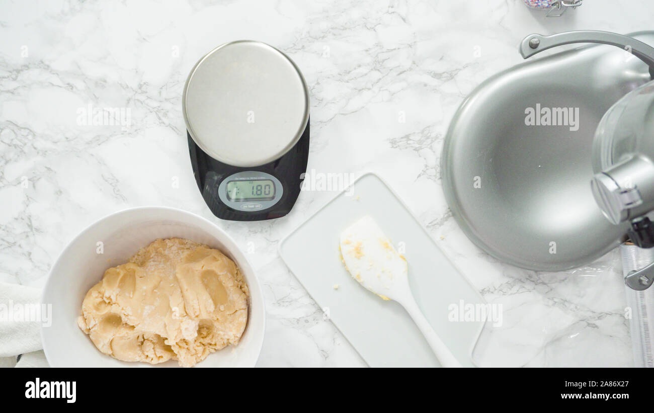 Step by step. Flat lay. Measuring cookie dought with a digital kitchen ...