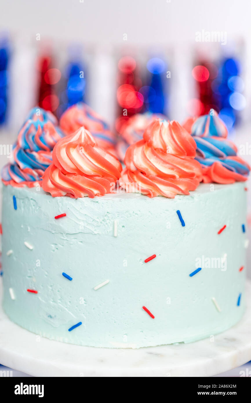Red, white, and blue round vanilla cake with buttercream frosting for ...