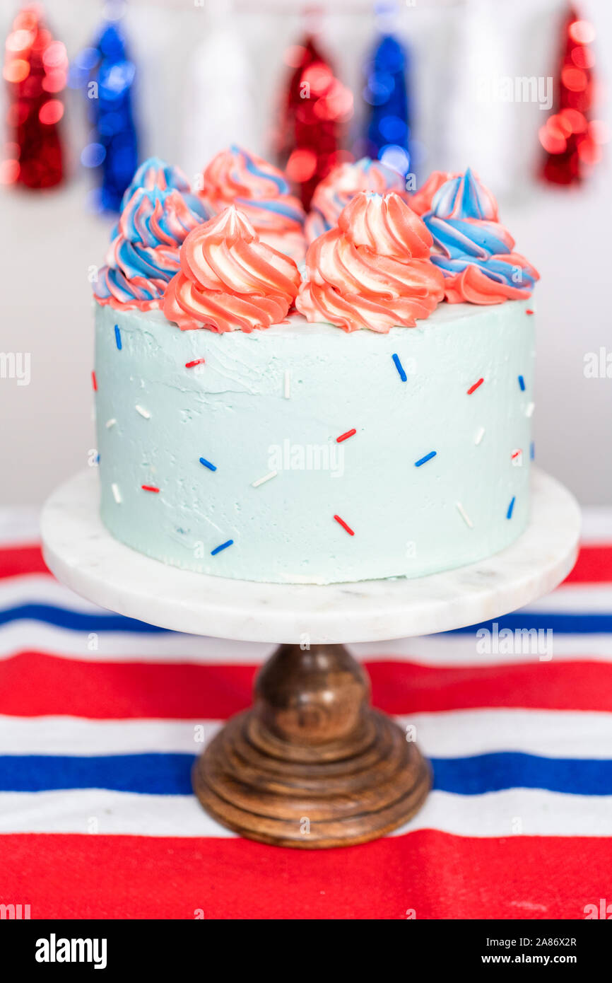 Red, white, and blue round vanilla cake with buttercream frosting for ...