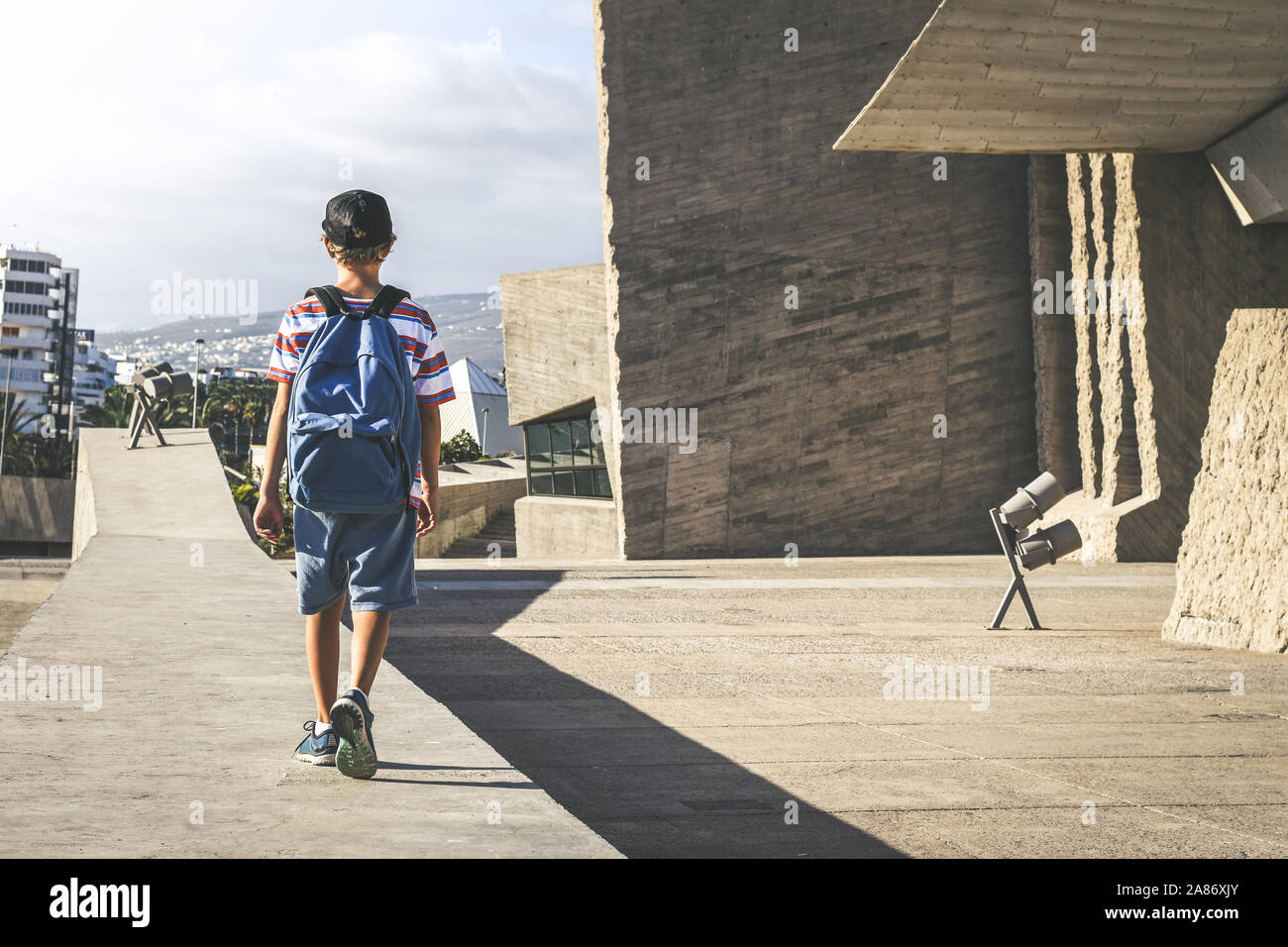 School boy walking out of school hi-res stock photography and images ...