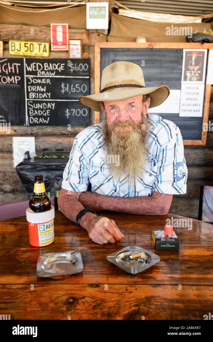 Portrait of an old opal miner with a wrinkled face and long white beard ...