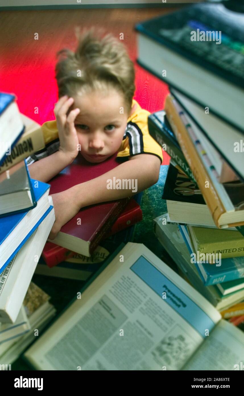 Funny boy unhappy books hi-res stock photography and images - Alamy