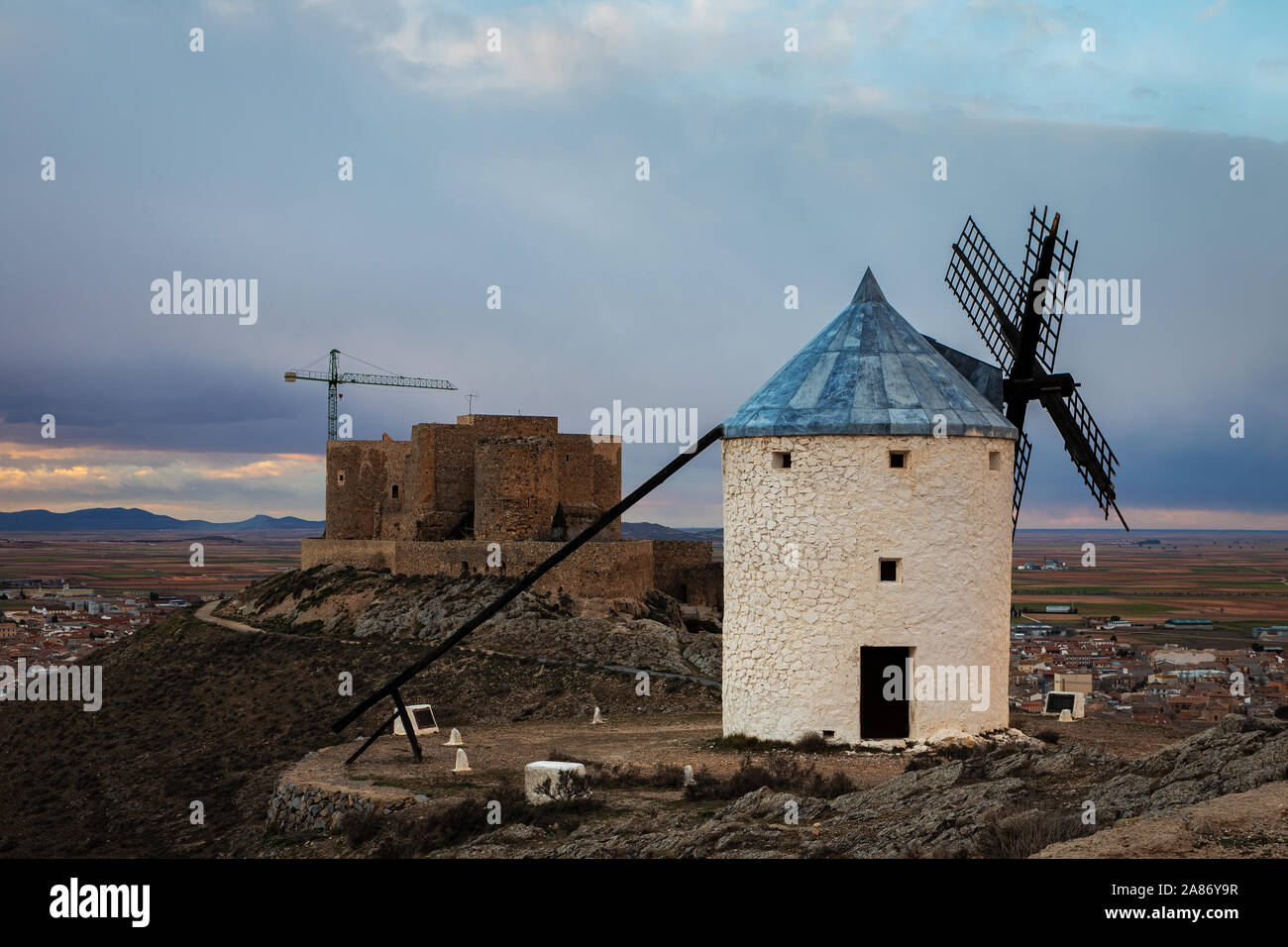 Traditional windmill and medieval castle in Consuegra. Spain Stock ...