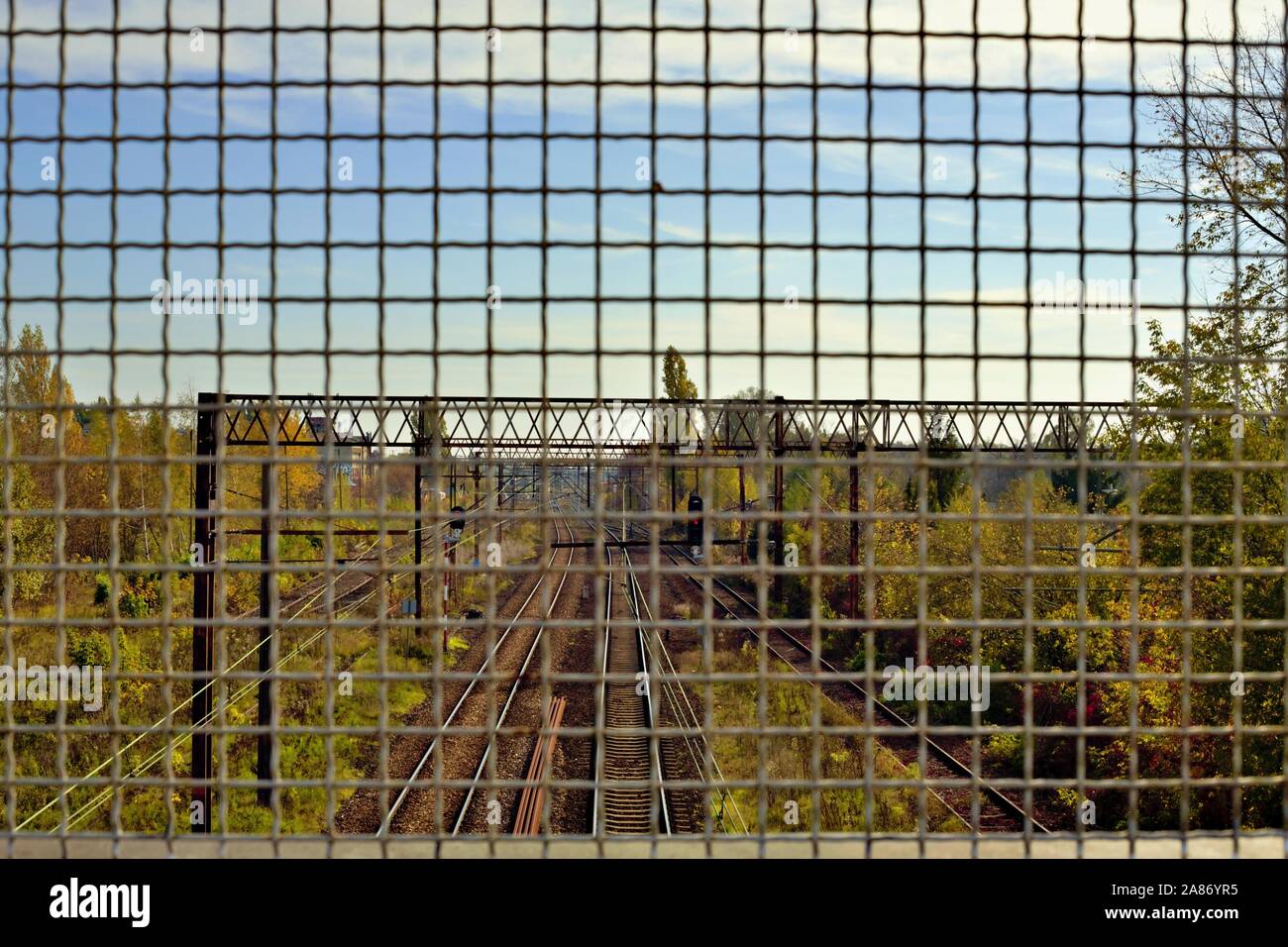Railways fence, Looking at a railways train link to fence Stock Photo ...