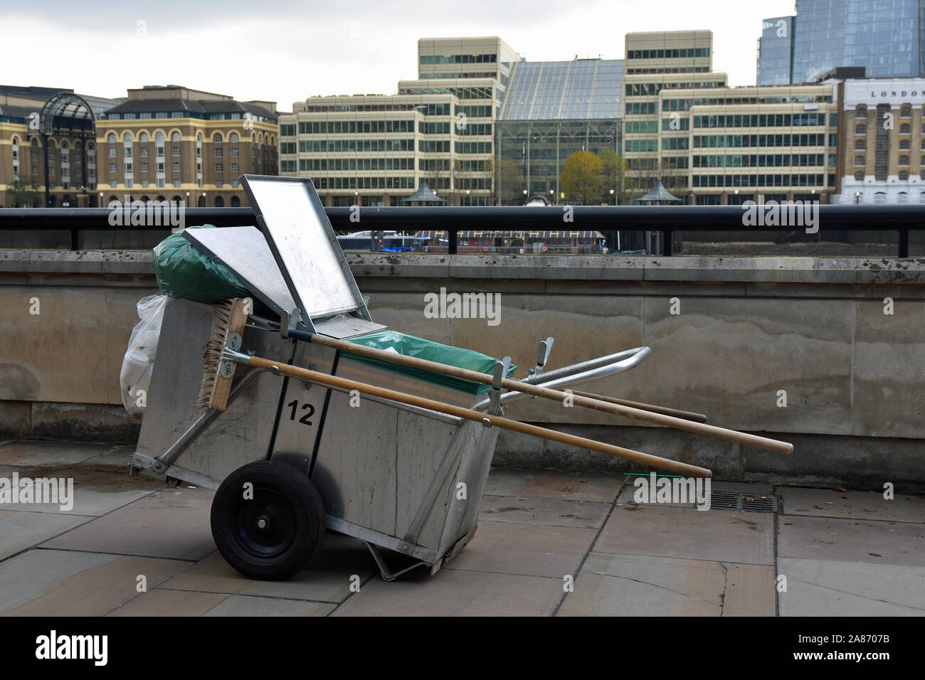 Public rubbish (trash) cart in London, England Stock Photo - Alamy