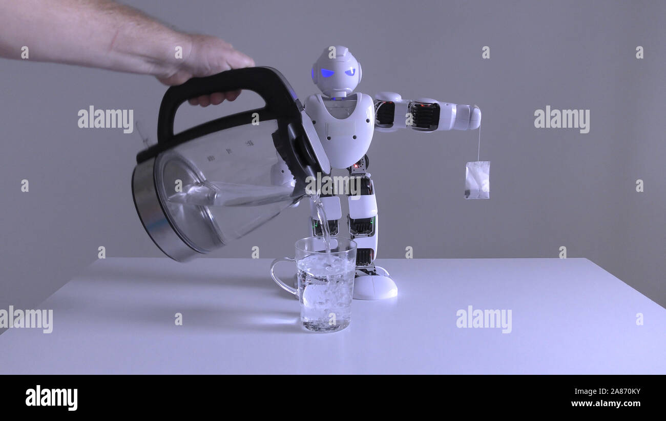 A domestic android humanoid robot try brewing tea for his master by ...