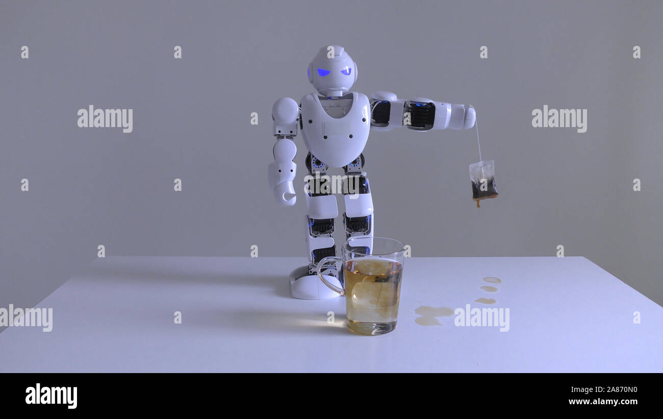 A domestic android humanoid robot helps brewing tea for his master by ...