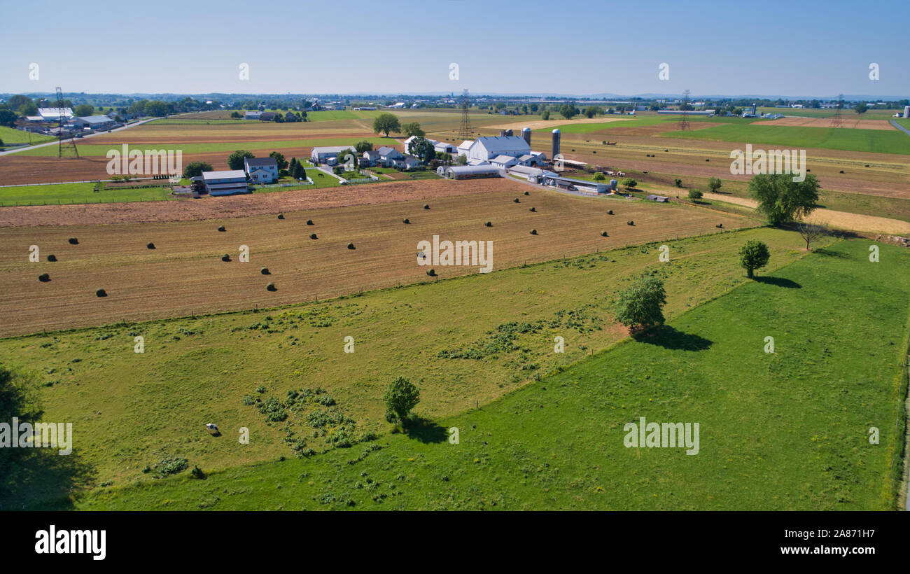 Aerial View of Amish Farm Harvest Rolled Crops ready for Storage on a ...