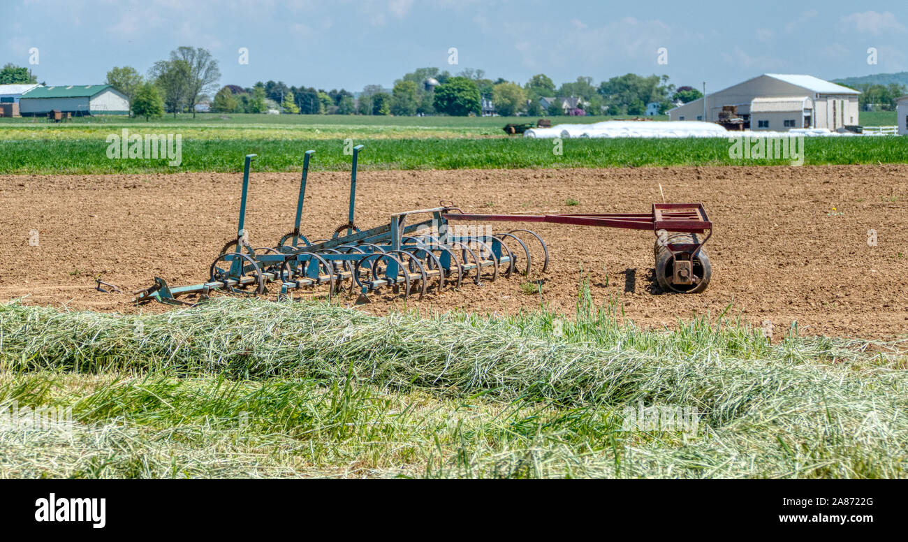 Antique Amish Farm Equipment Seating in the Field waiting to be Used ...