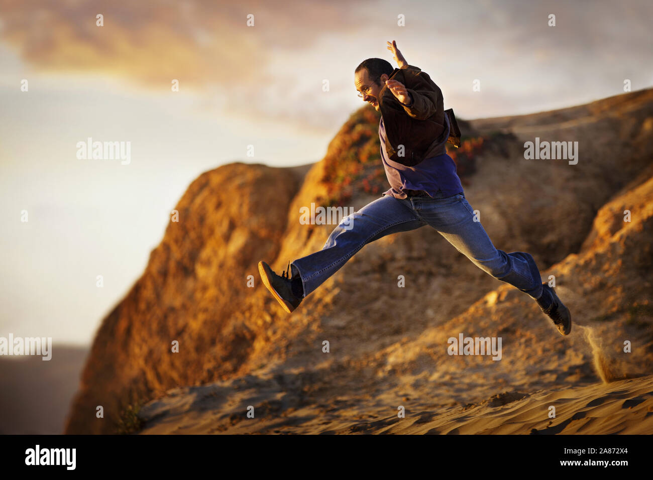 Man leaping on sandy hi-res stock photography and images - Alamy