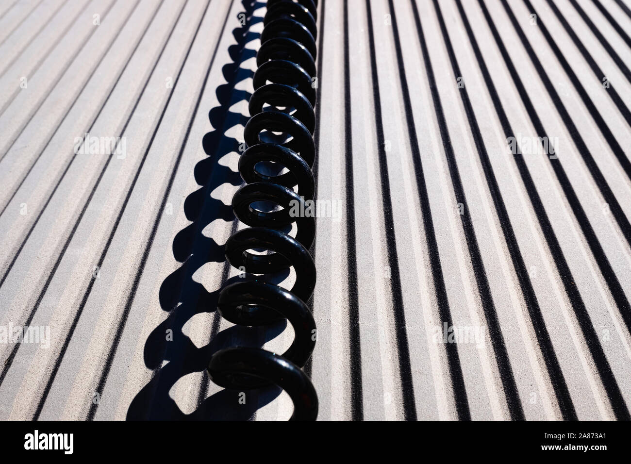 Wavy cable on a solid colored foam background Stock Photo - Alamy