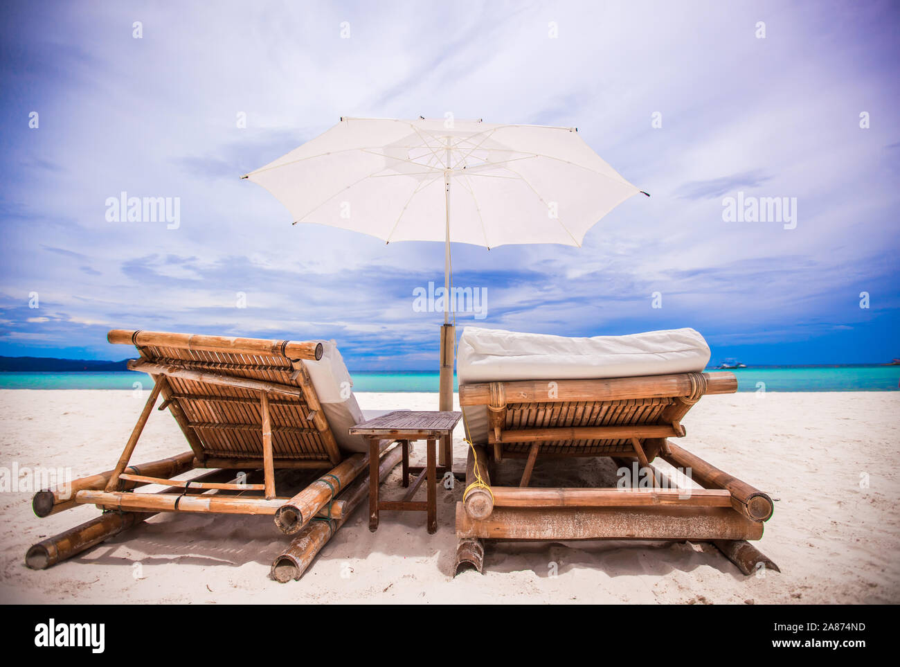 Beach wooden chairs for vacation on tropical beach Stock Photo - Alamy