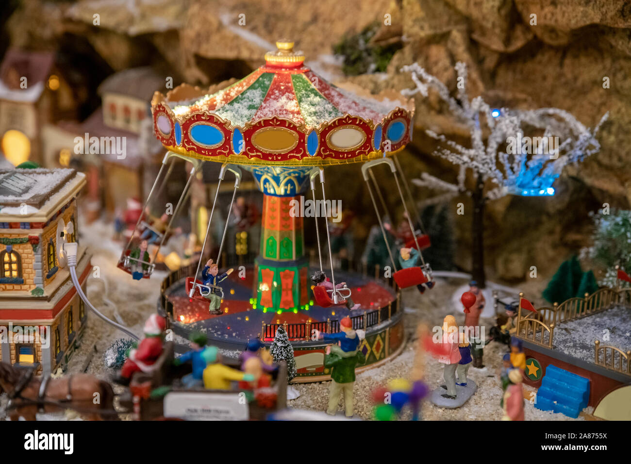 Amusement park in miniature with carousels in winter Stock Photo - Alamy