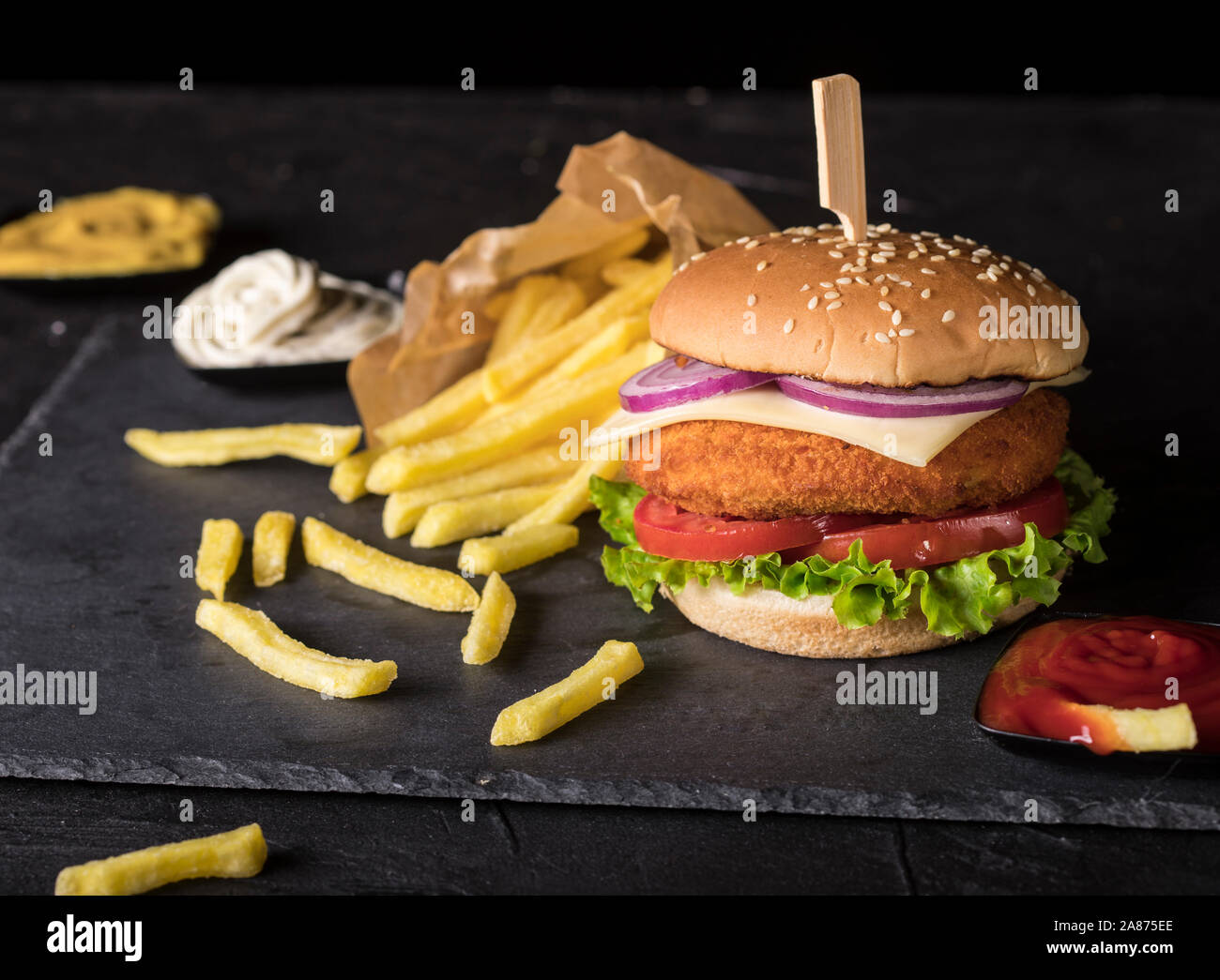 Fresh delicious burger with meatball, cheese, tomato, onion and lettuce ...